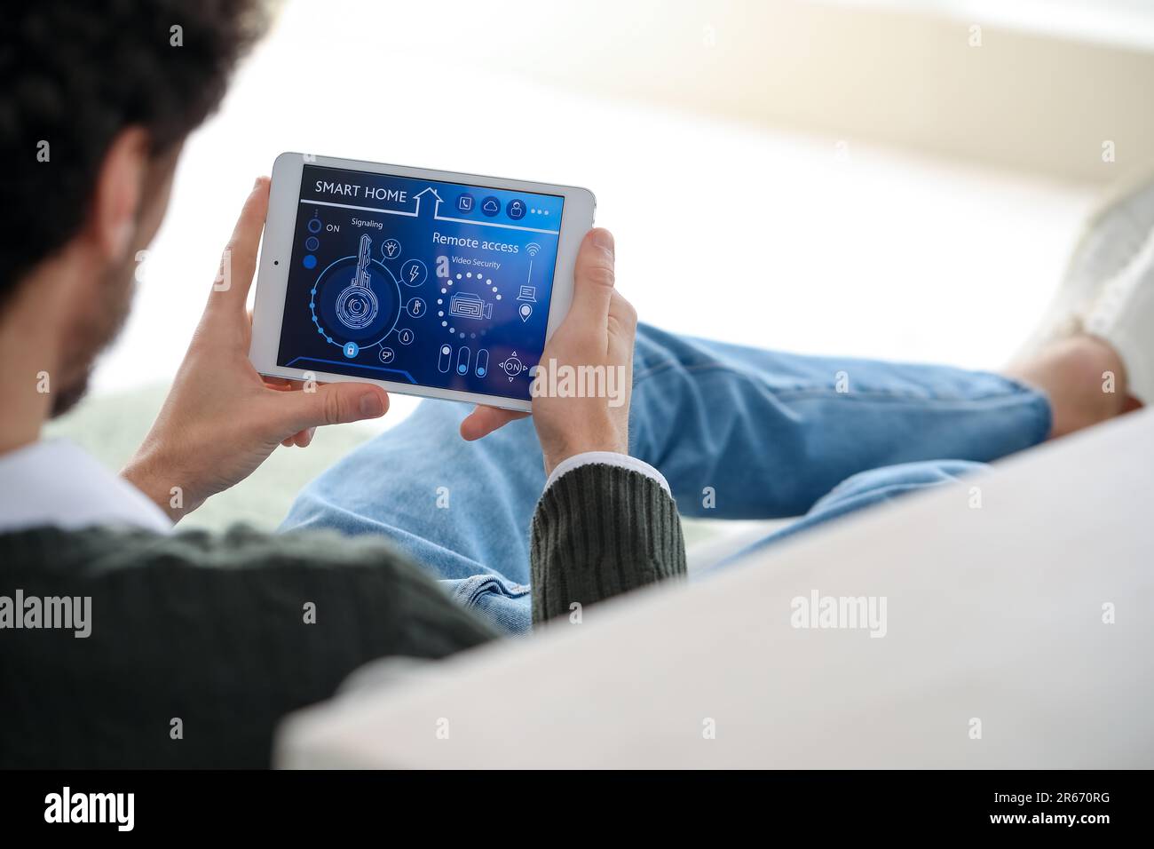 Young man using smart home security system control panel, closeup Stock ...