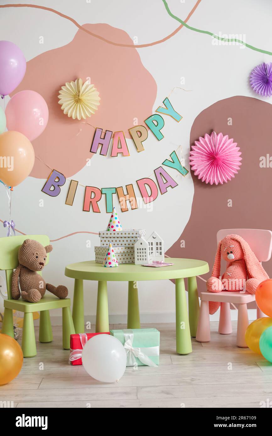 Interior for child's birthday party with balloons, toys and furniture ...