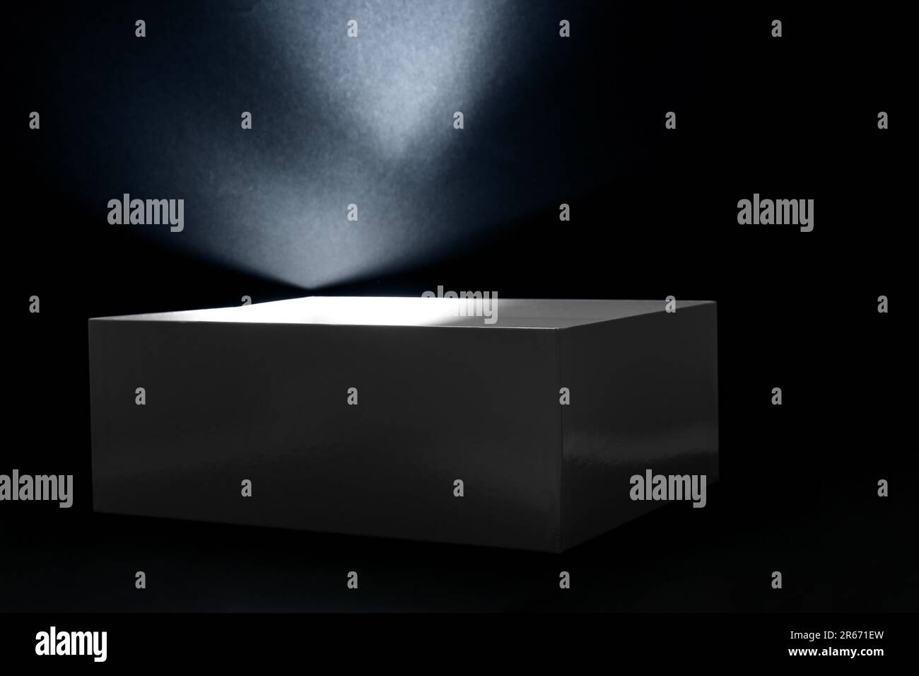 Camera flash in box on dark background Stock Photo - Alamy