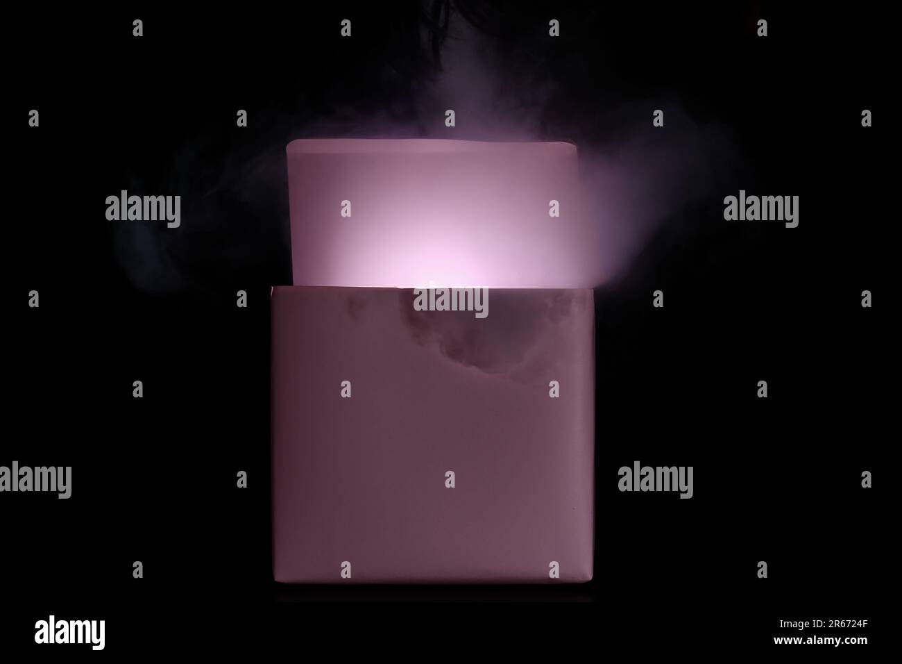 Camera flash in box on black background Stock Photo - Alamy