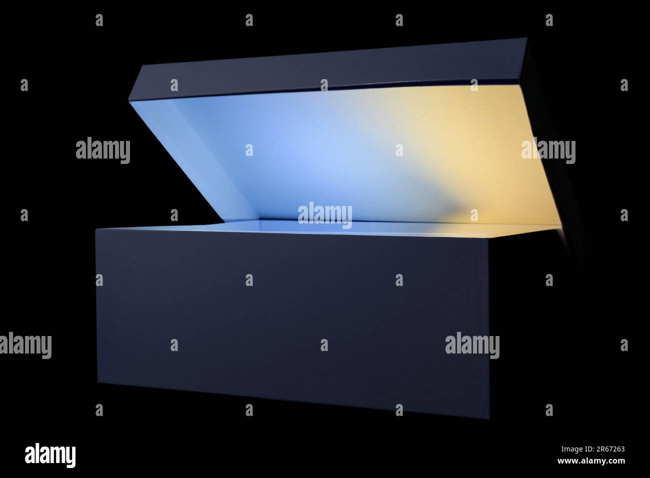 Camera flash in box on black background Stock Photo - Alamy