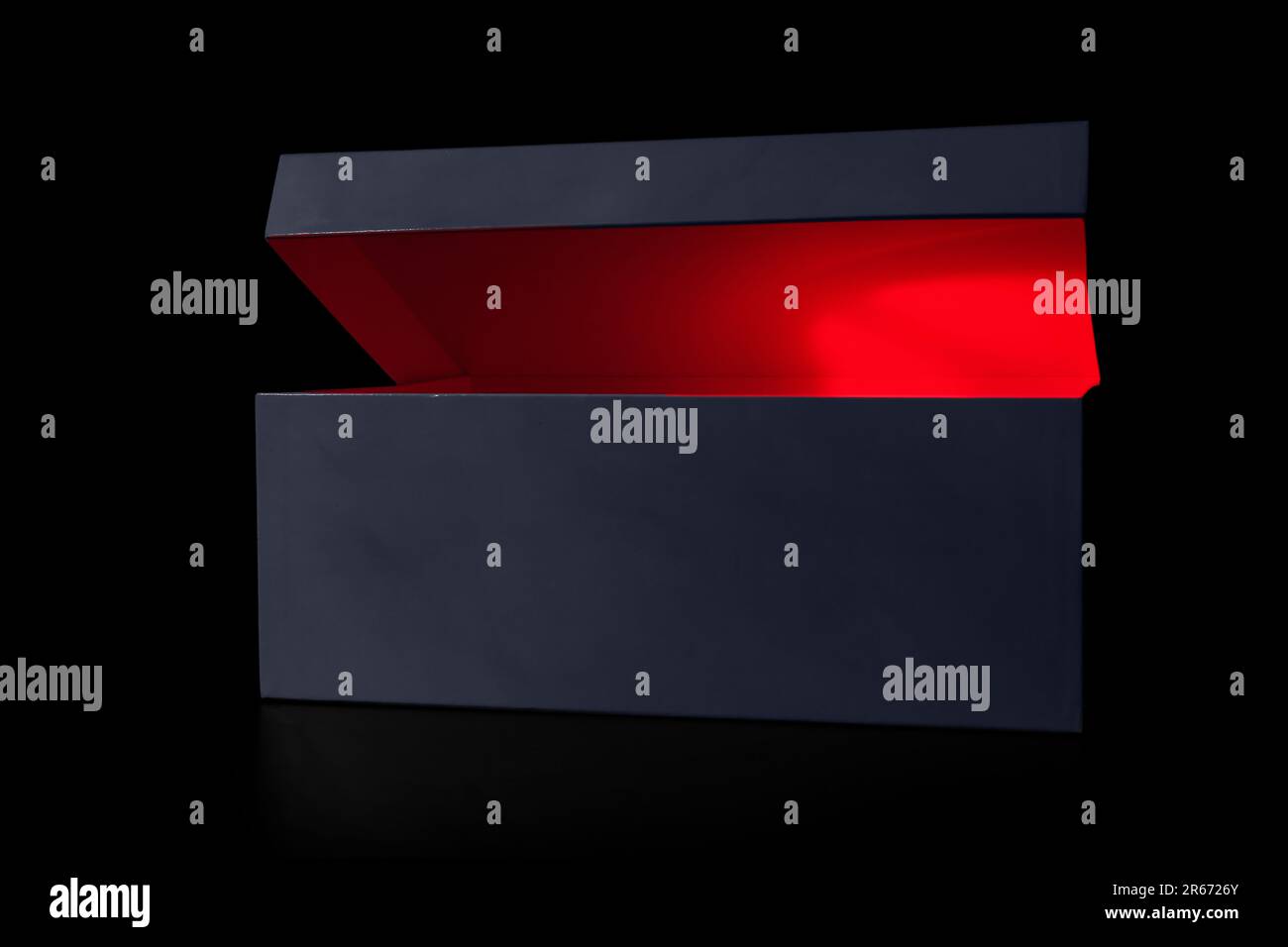 Camera flash in box on black background Stock Photo - Alamy