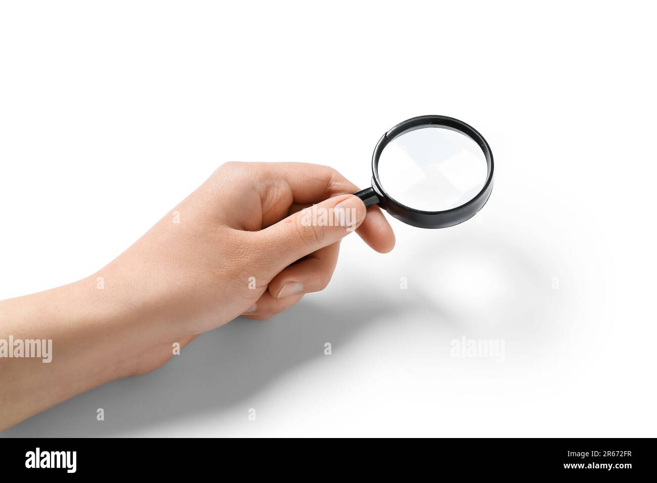Female hand with mini magnifier isolated on white background Stock ...