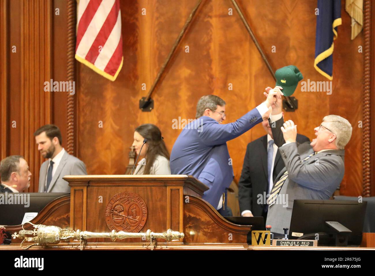 South Carolina House Speaker Murrell Smith, R-Sumter, left, tries to ...