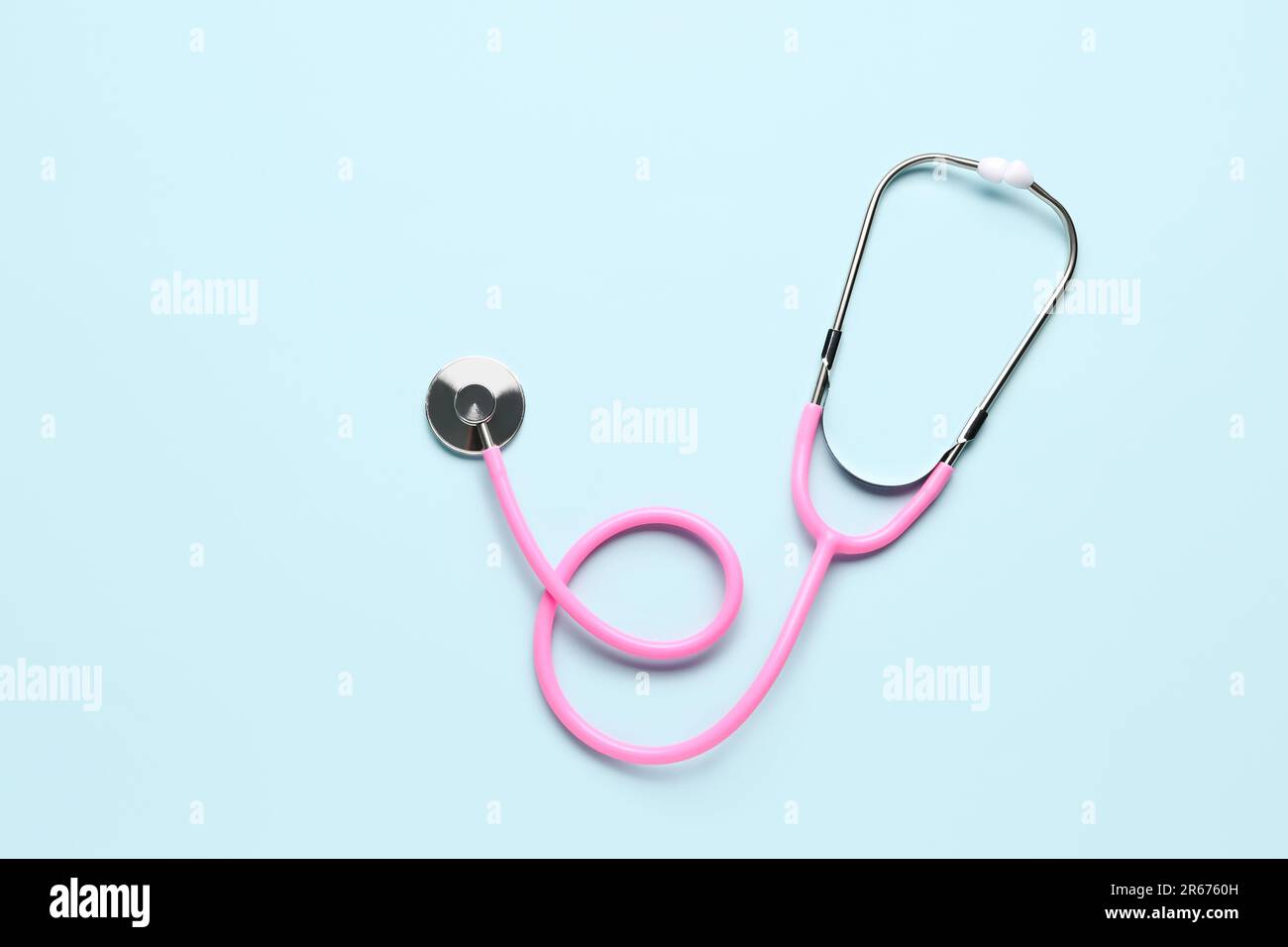 Modern stethoscope on light blue background Stock Photo - Alamy