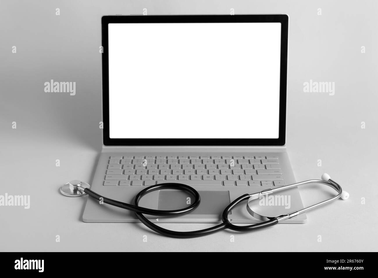 Stethoscope and laptop on light background Stock Photo - Alamy