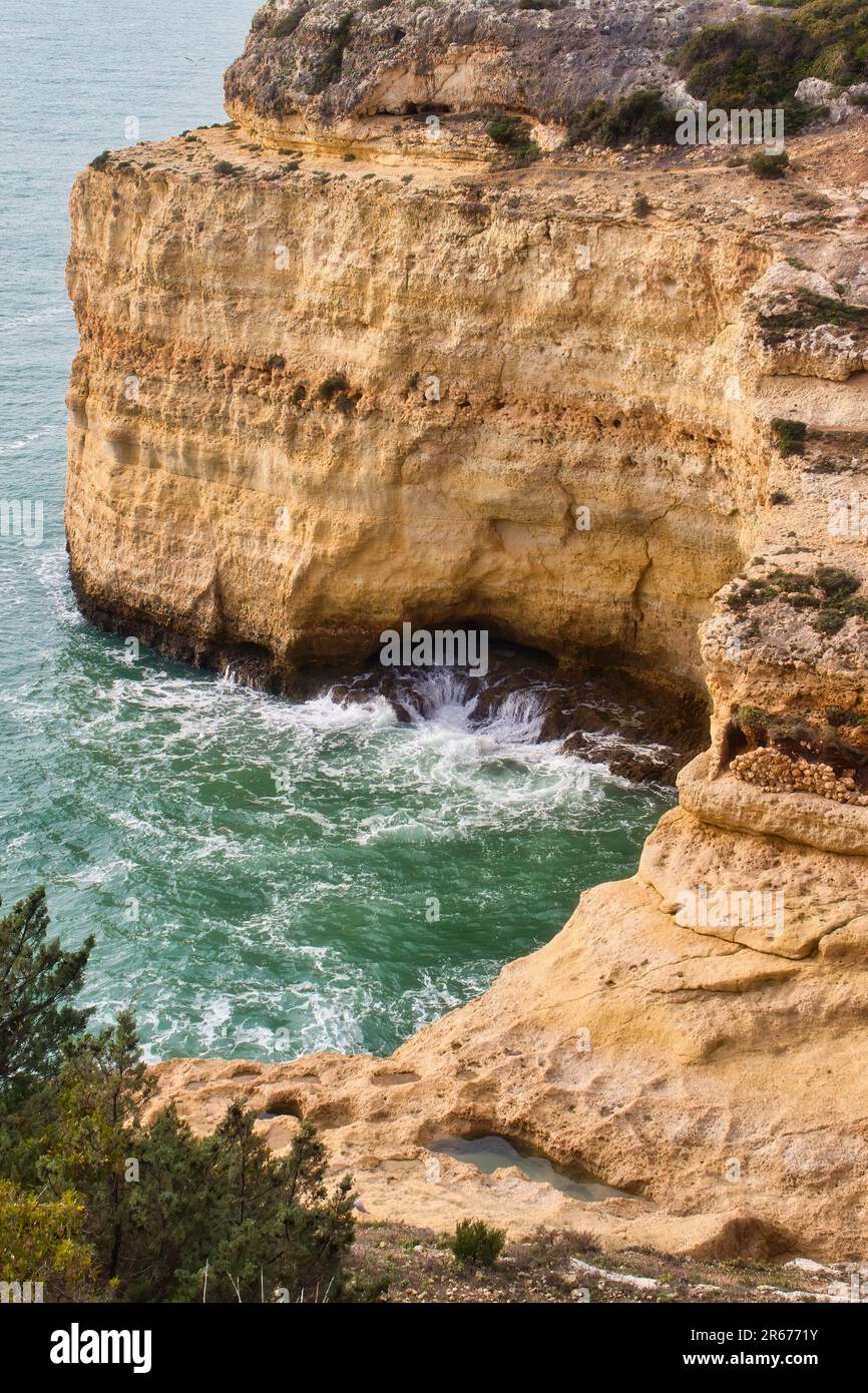 Water running off ledge on a cliff in the Atlantic Ocean along the ...