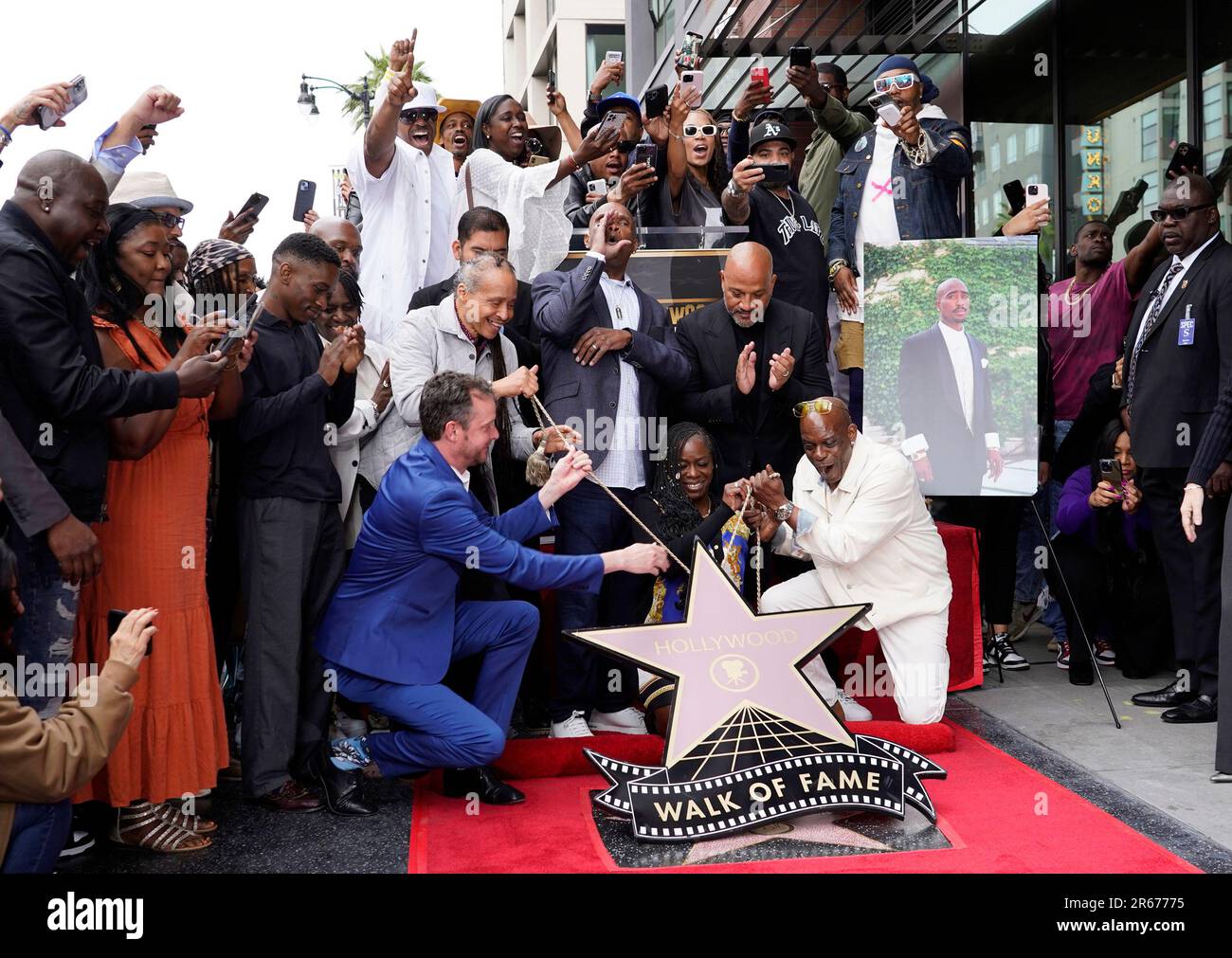 Fans, friends and family of the late rapper/actor Tupac Shakur cheer as ...