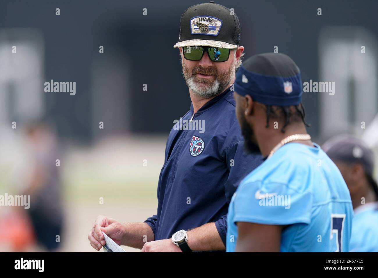 Tennessee Titans defensive coordinator Shane Bowen, left, talks with ...