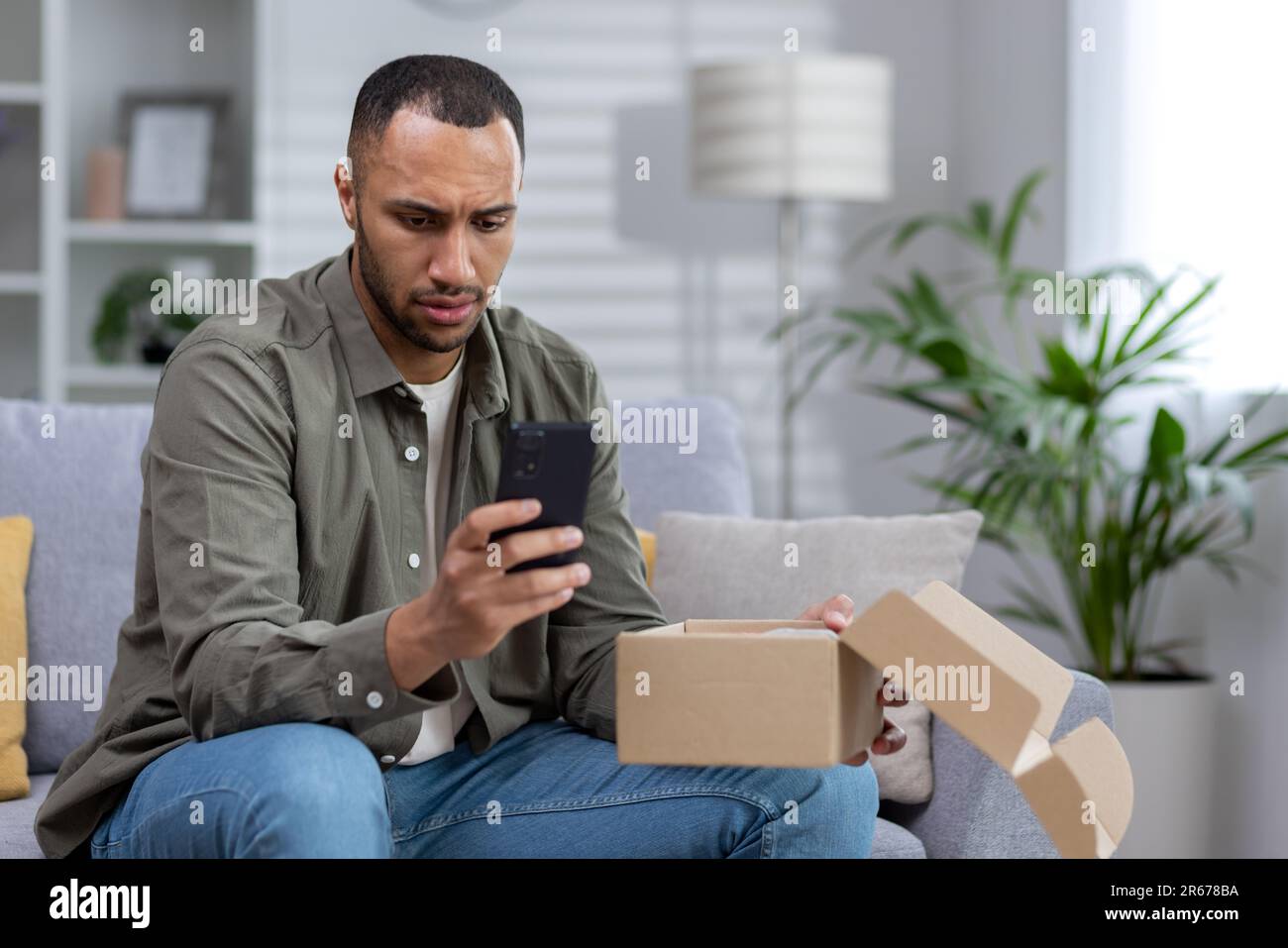 Confused angry customer calling hi-res stock photography and images - Alamy