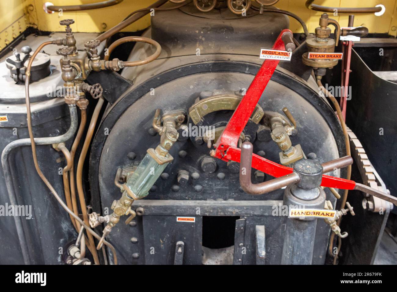 An image of a vintage steam engine with weathered metal piping and ...