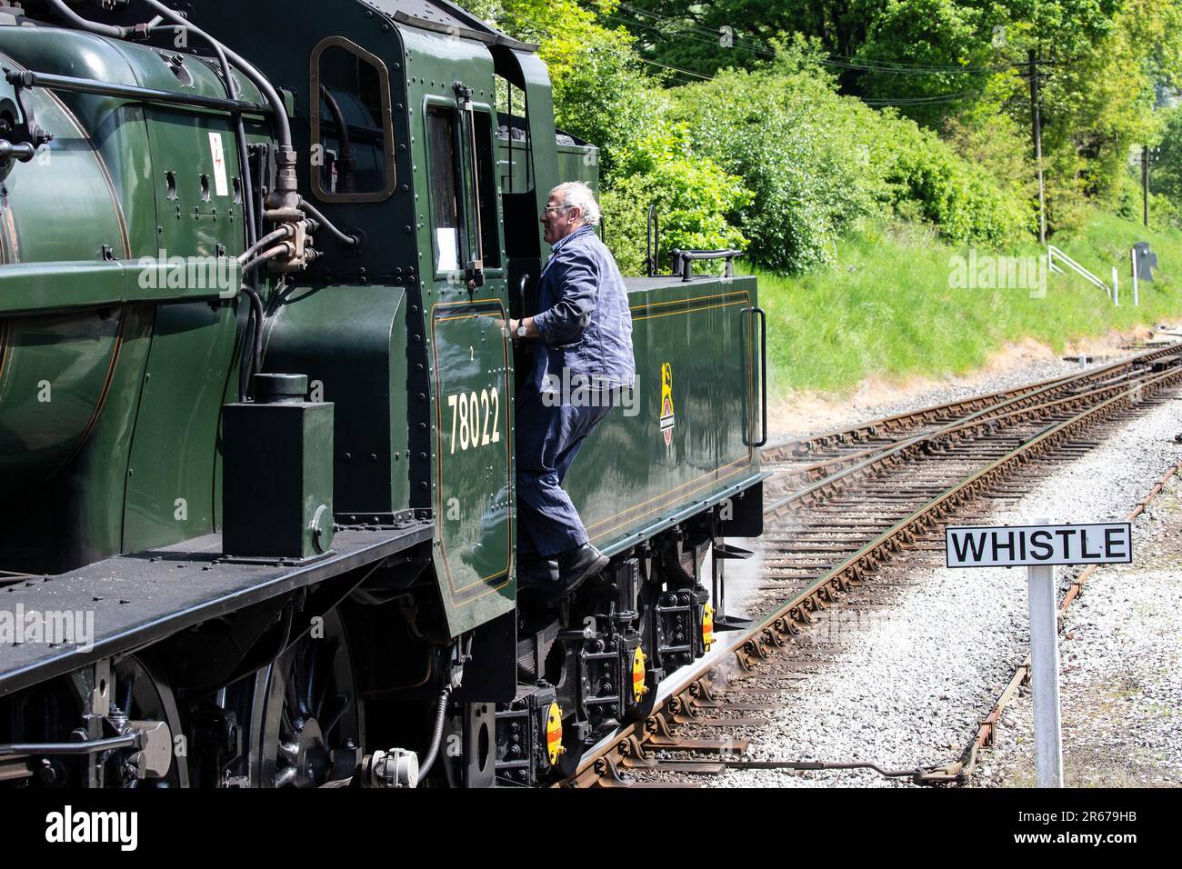Engineer climbing on to locomotive hi-res stock photography and images ...