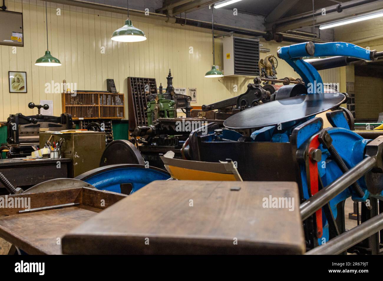 This image portrays an interior space filled with tools and work tables ...