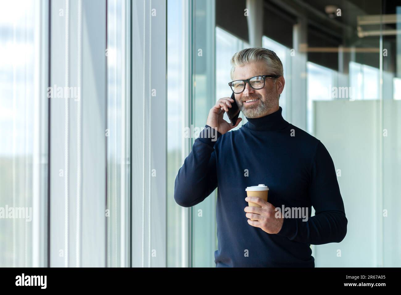 Portrait of a senior handsome gray-haired man designer, architect ...
