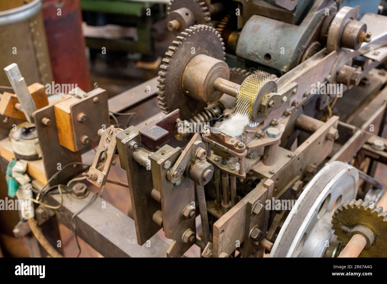 This image depicts a modern industrial machine used to create cone ...