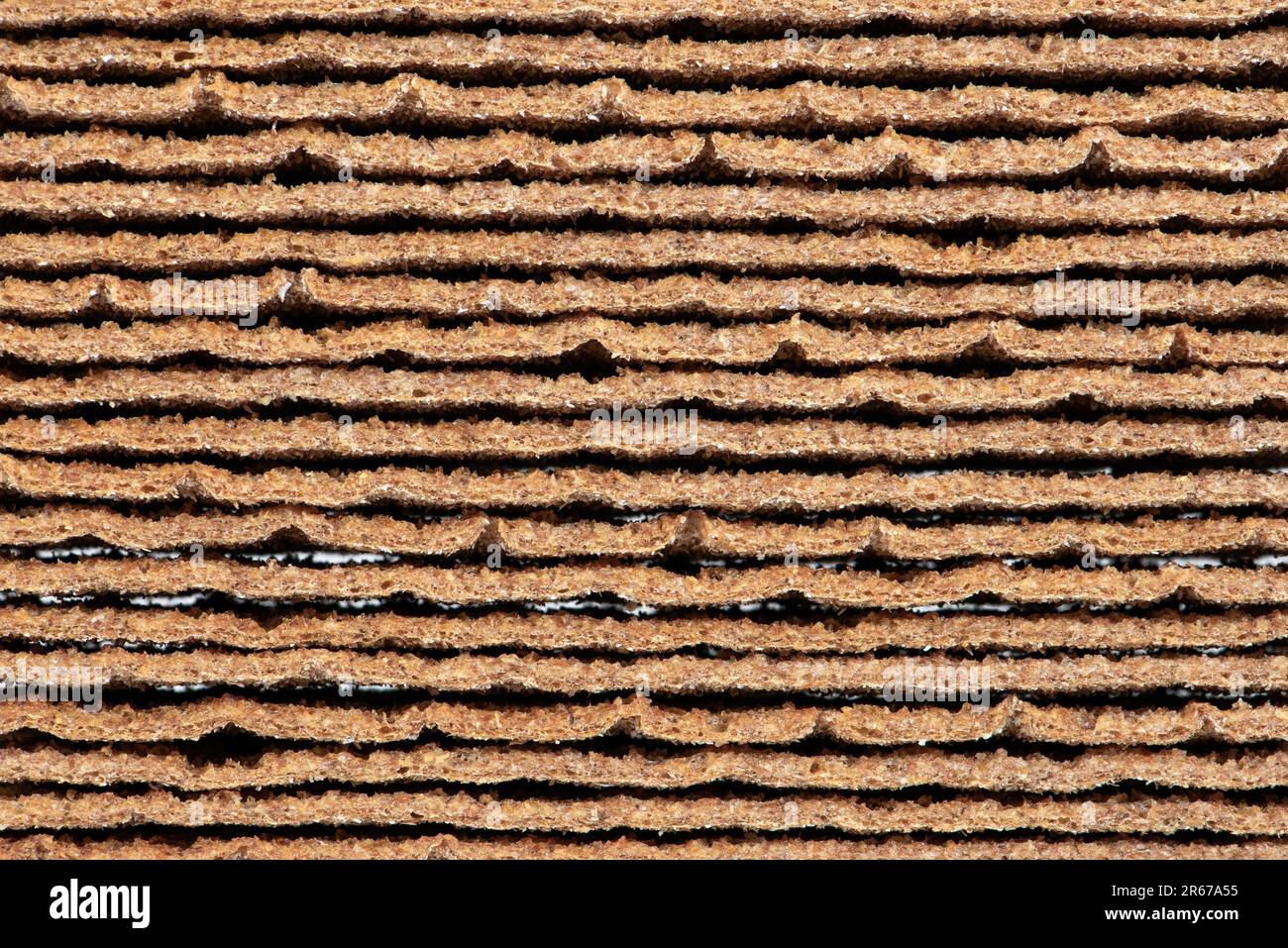 Texture of rye chips. Chips are stacked, one on top of the other, close ...