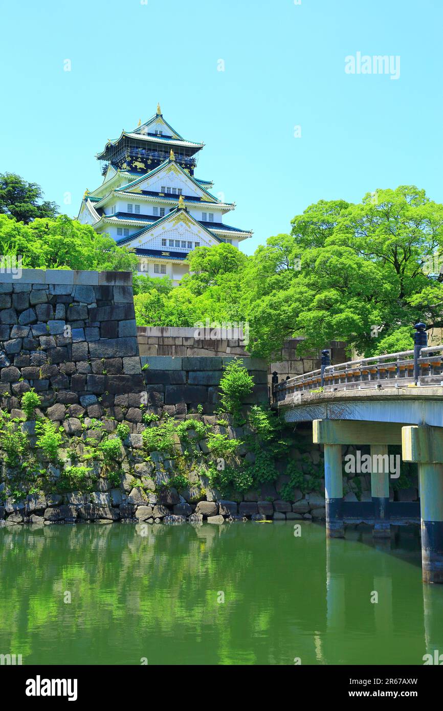Osaka Castle tower and Gokurakubashi Bridge in fresh green Stock Photo ...