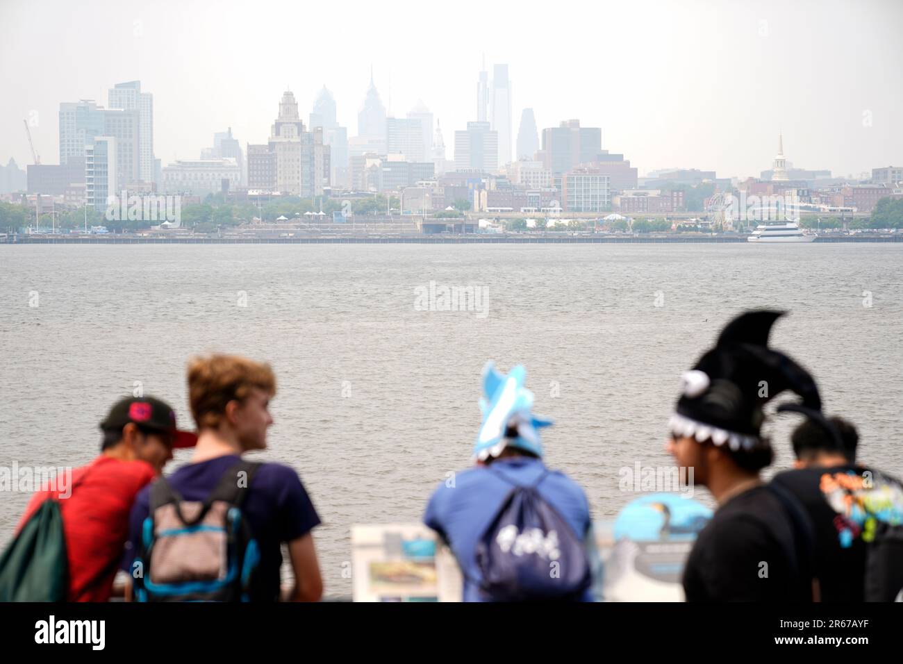 People in Camden, N.J., view the hazy Philadelphia skyline, Wednesday ...