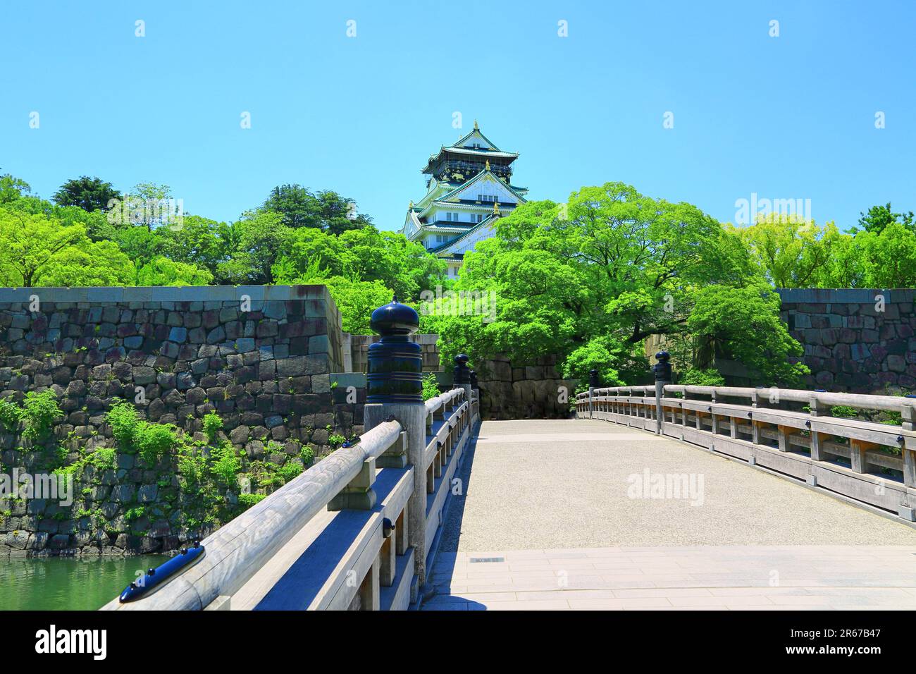 Osaka Castle tower and Gokurakubashi Bridge in fresh green Stock Photo ...