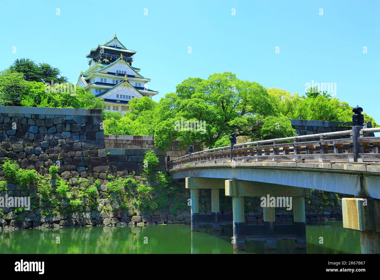 Osaka Castle tower and Gokurakubashi Bridge in fresh green Stock Photo ...