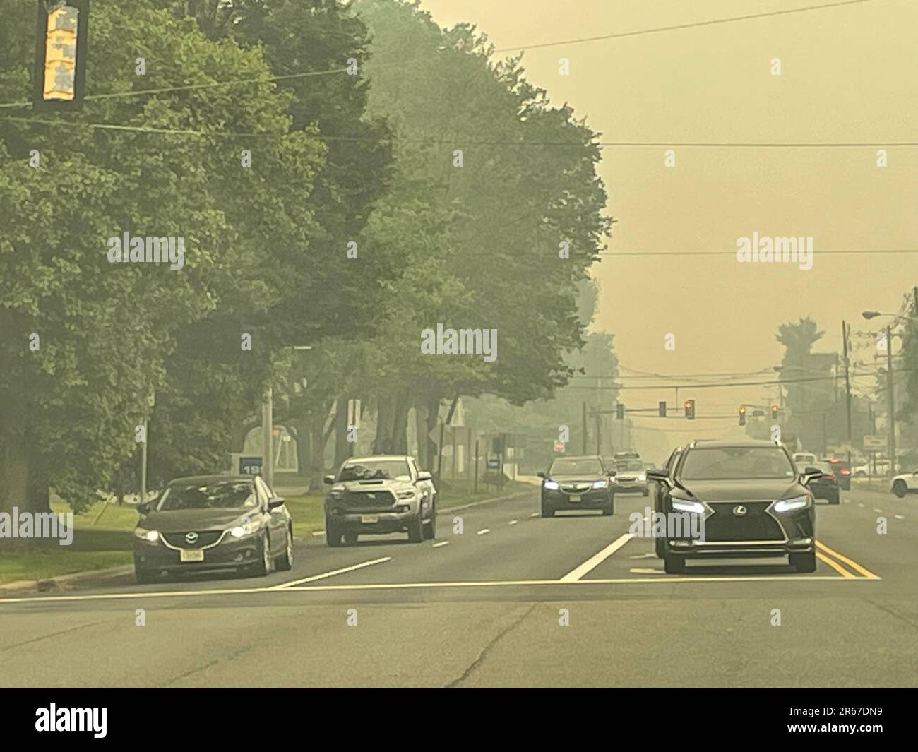 A hazy sky, caused by wildfires, creates low visibility and hazardous ...