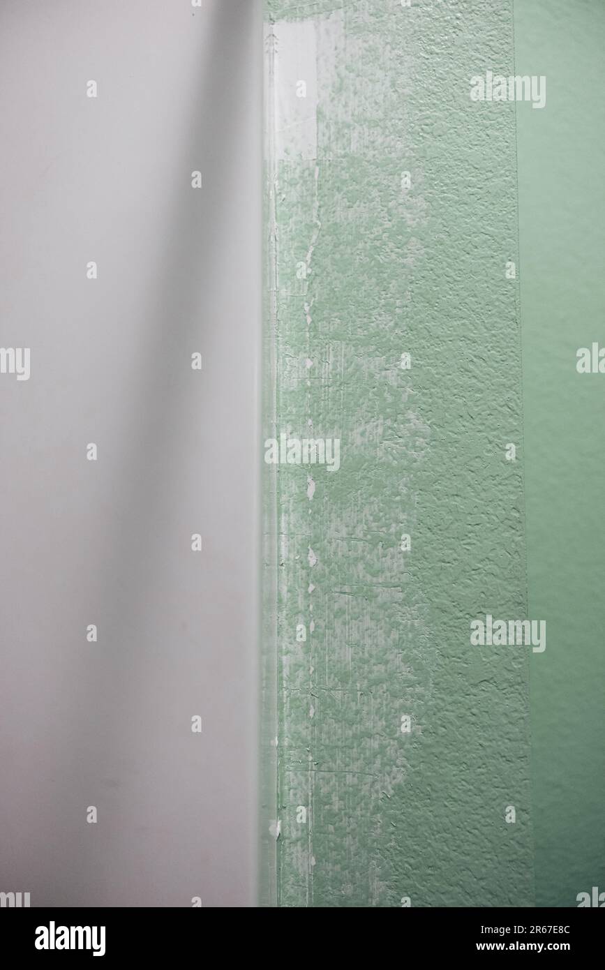 A crack in a bathroom wall between the textured wall and the shower ...