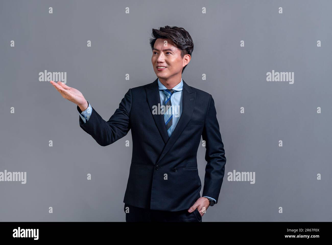 Confident Asian businessman posing in professional outfit on isolated ...