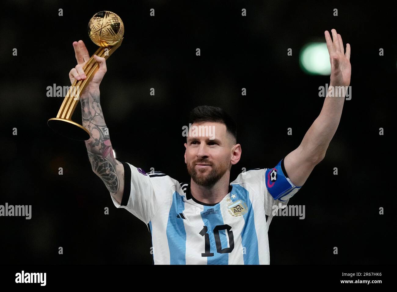 FILE - Argentina's Lionel Messi waves after receiving the Golden Ball ...