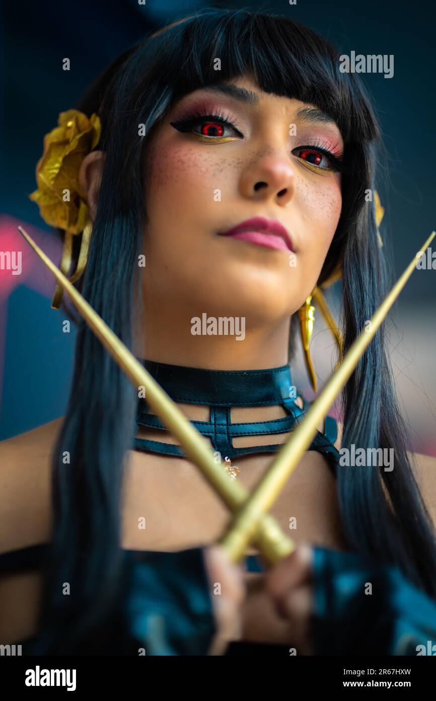 A female avatar stands in a powerful pose, her right hand gripping two ...