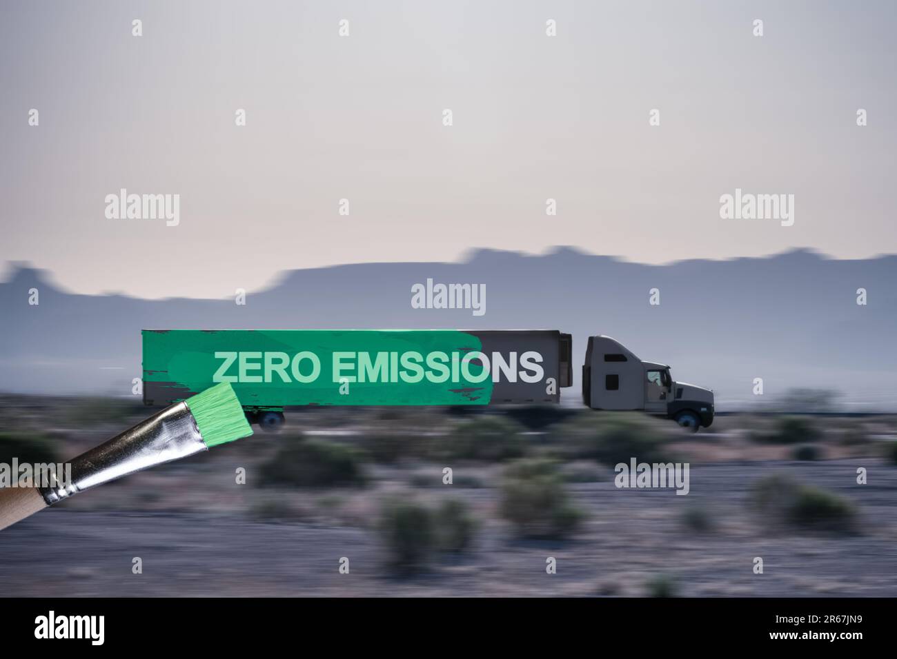 truck on the road with the text Zero emissions Stock Photo - Alamy