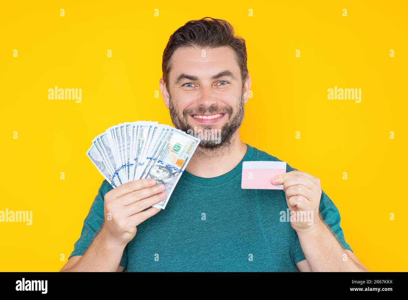 Man with money cash. Dollar banknotes. Portrait of man holding bunch of ...