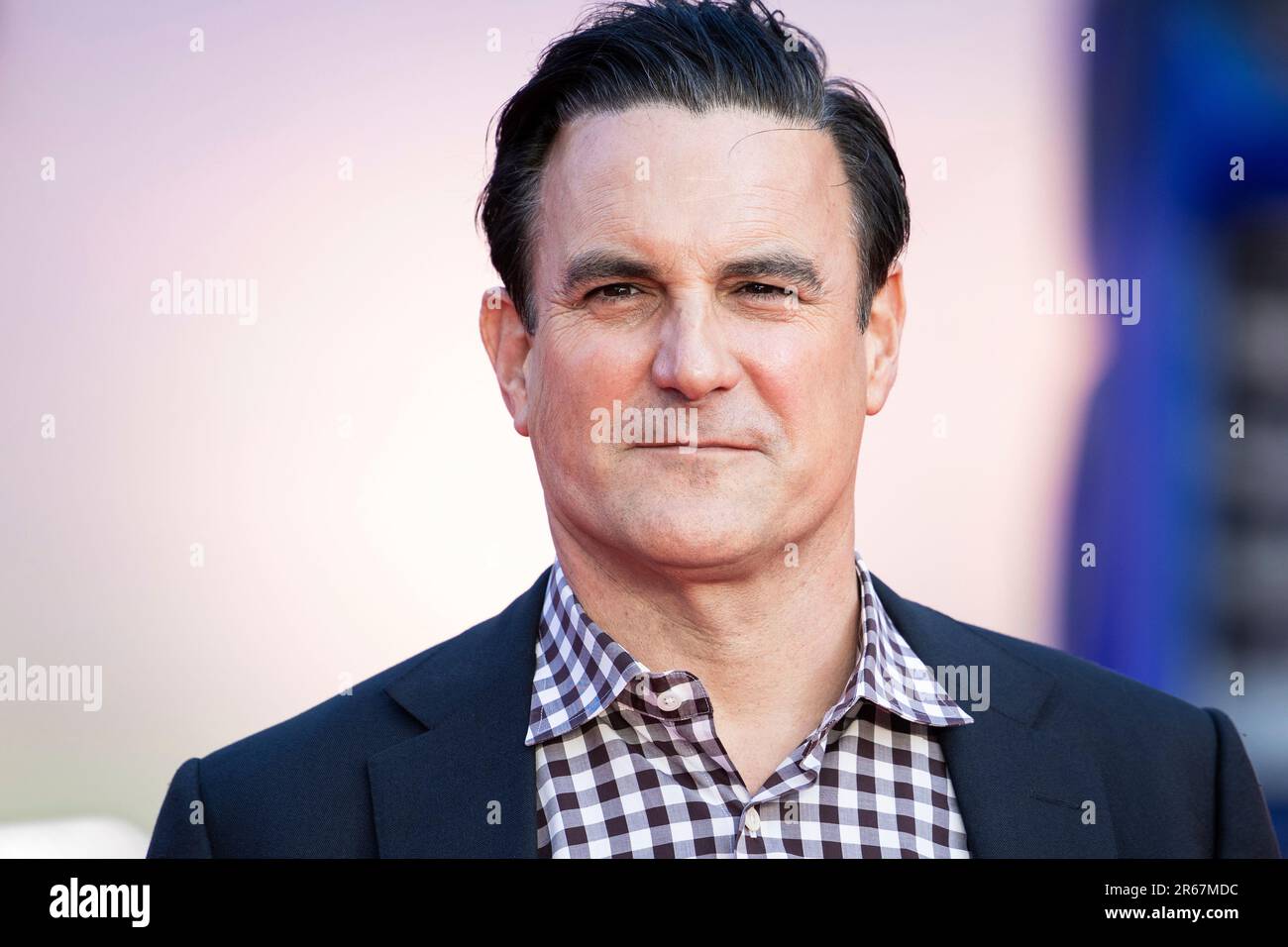 Mark Vahradian poses for photographers upon arrival at the premiere of ...
