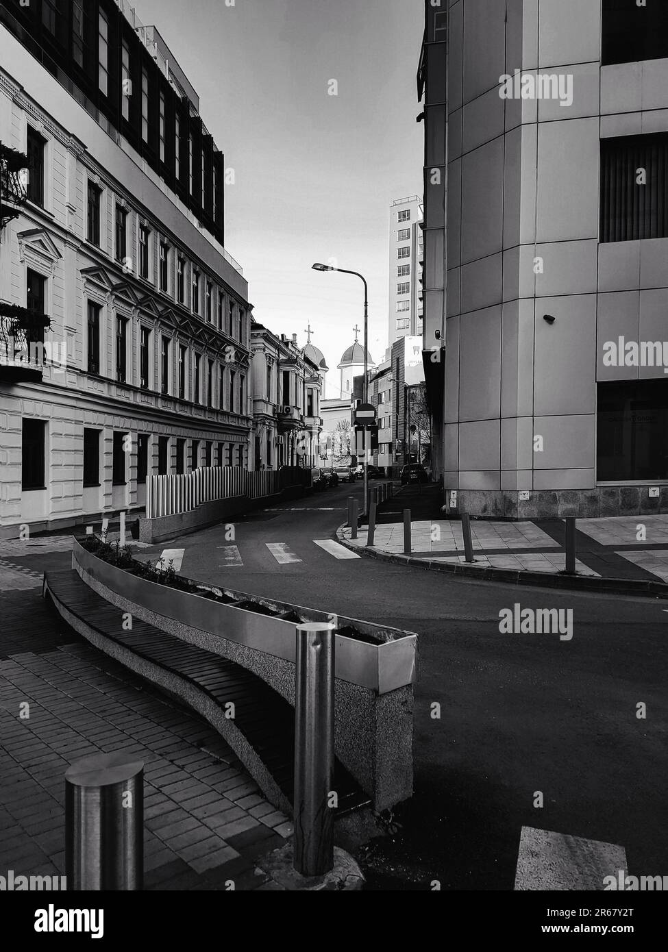An aerial view of a bustling city street corner featuring a variety of ...