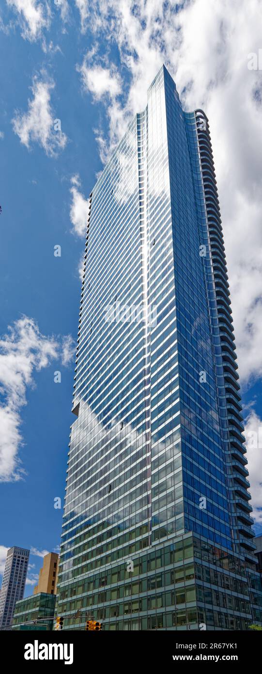 The blue glass residential tower 252 East 57th Street sits atop a half ...