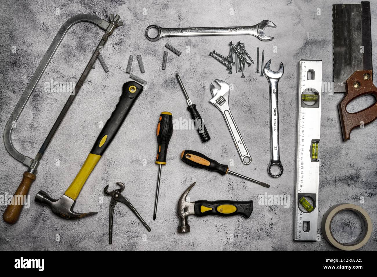 A bunch of wrenches and tools on a white and gray surface Stock Photo ...