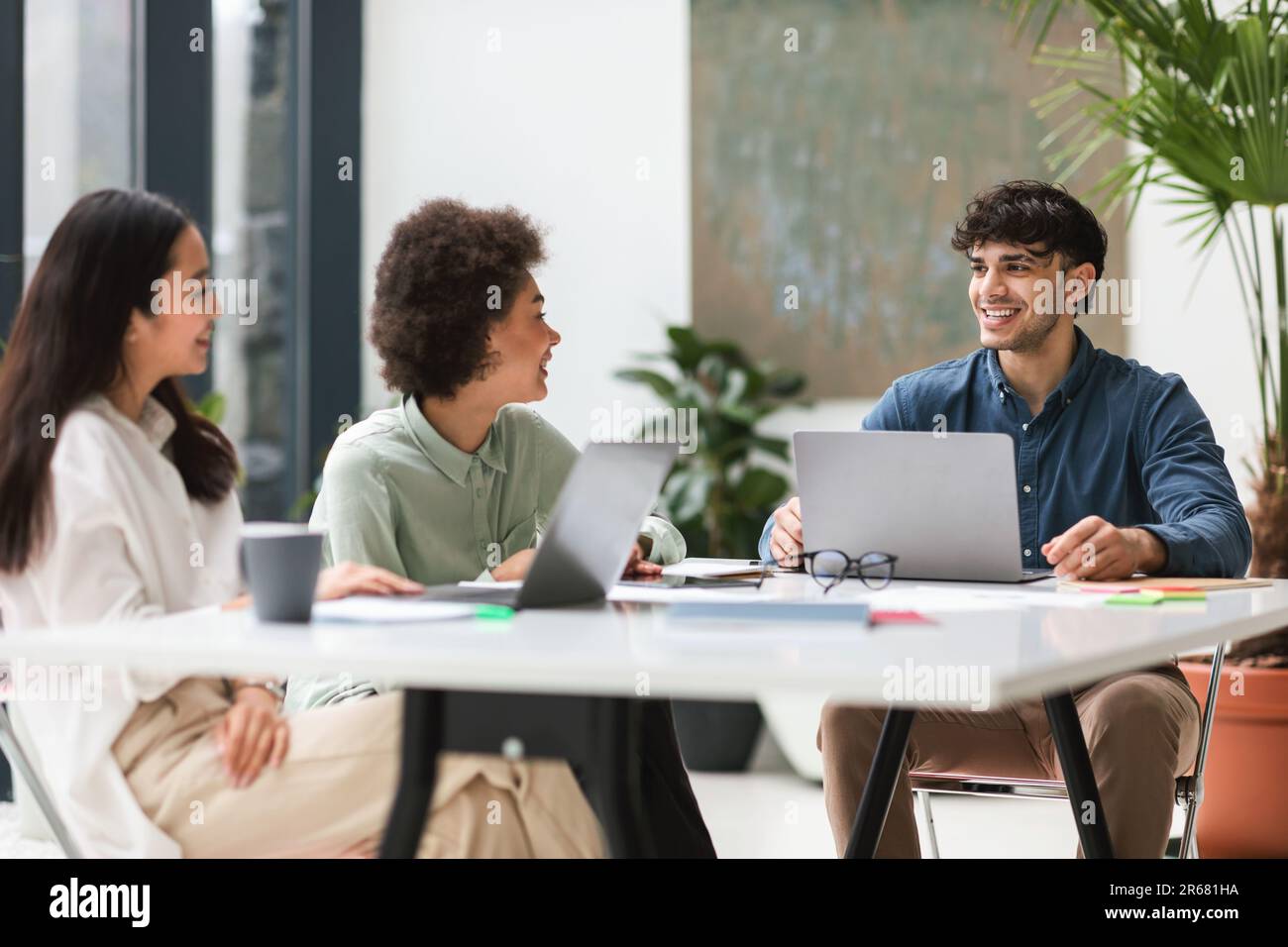 Multiracial business team using laptops hi-res stock photography and ...