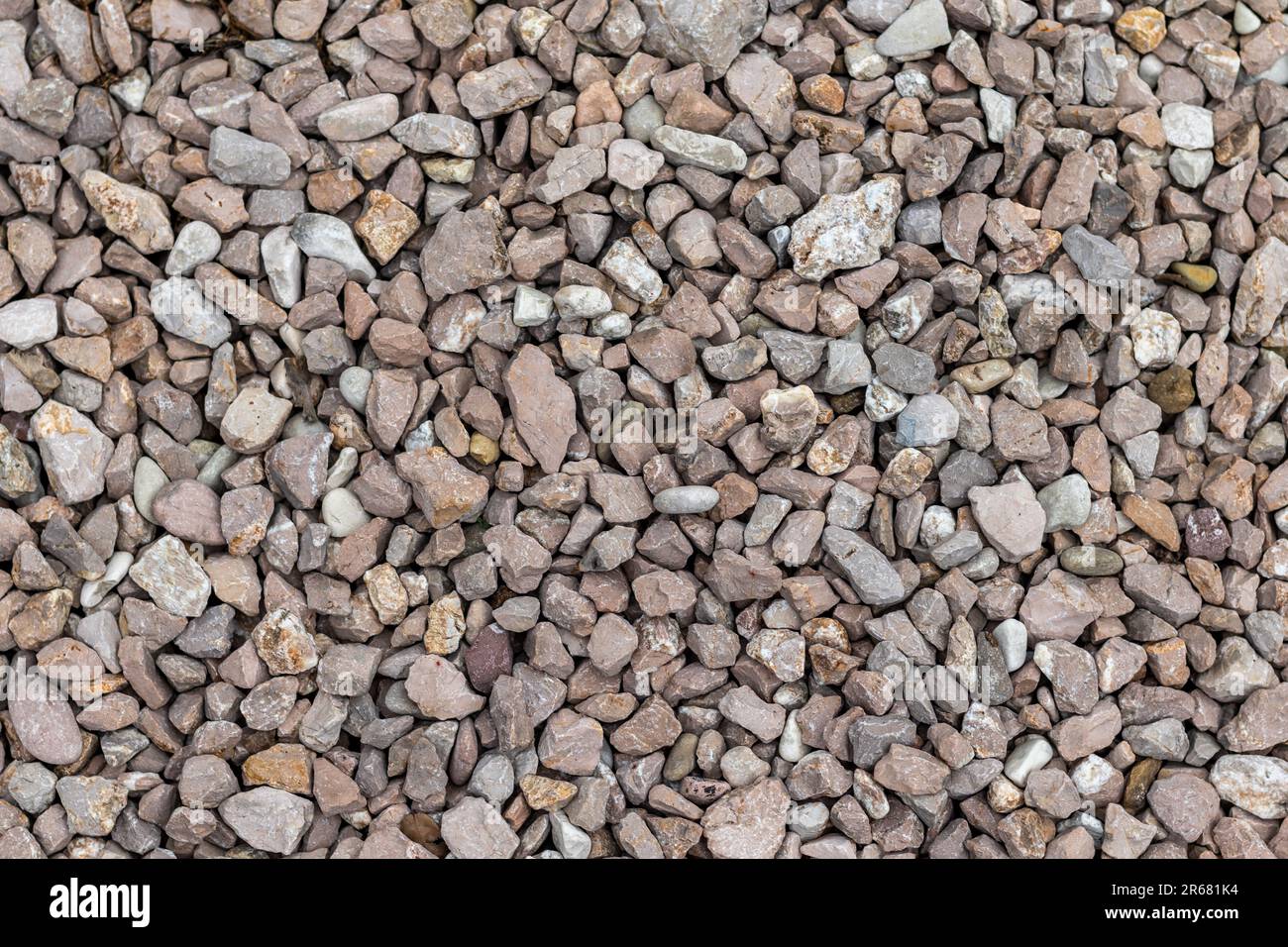 round stones on the ground in the garden Stock Photo - Alamy