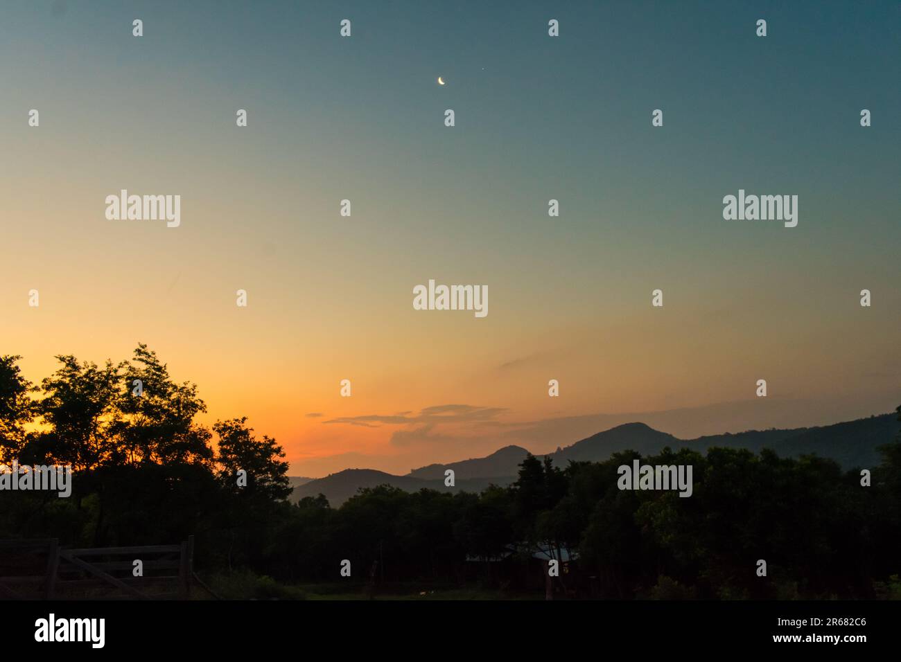 Sunset colors and crescent moon in the Carapina Valley - countryside of ...