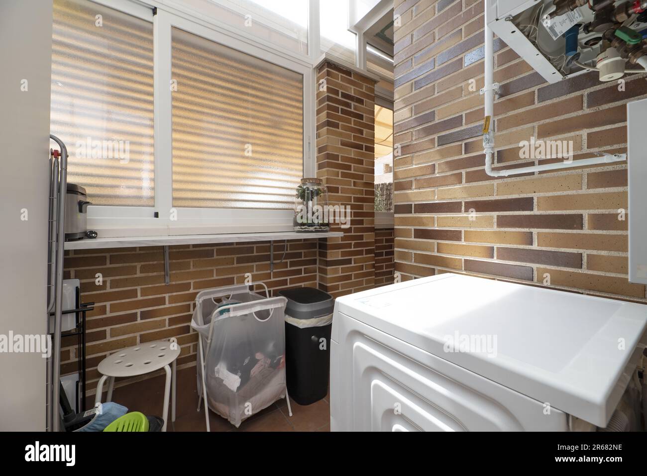 Laundry area in a closed terrace of an urban dwelling Stock Photo - Alamy
