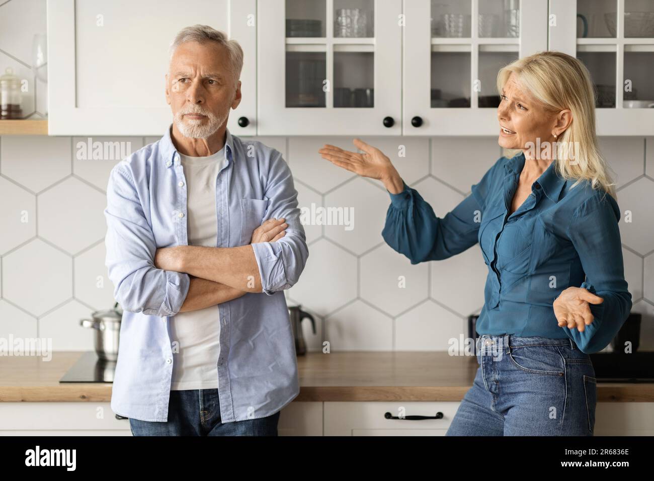 Domestic Conflicts. Portrait Of Senior Couple Arguing In Kitchen ...
