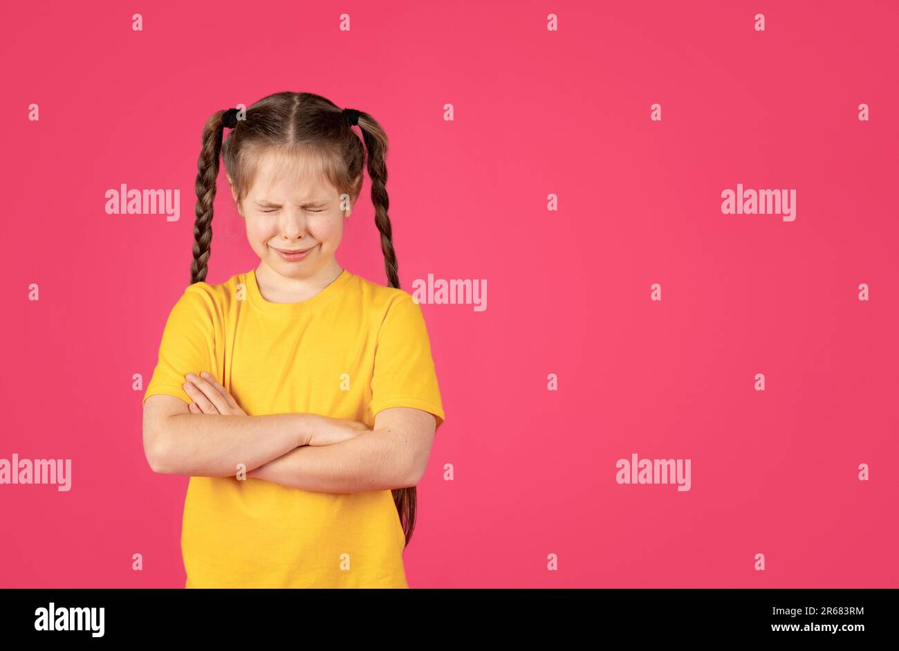 Portrait of cute little girl crying on pink background Stock Photo - Alamy