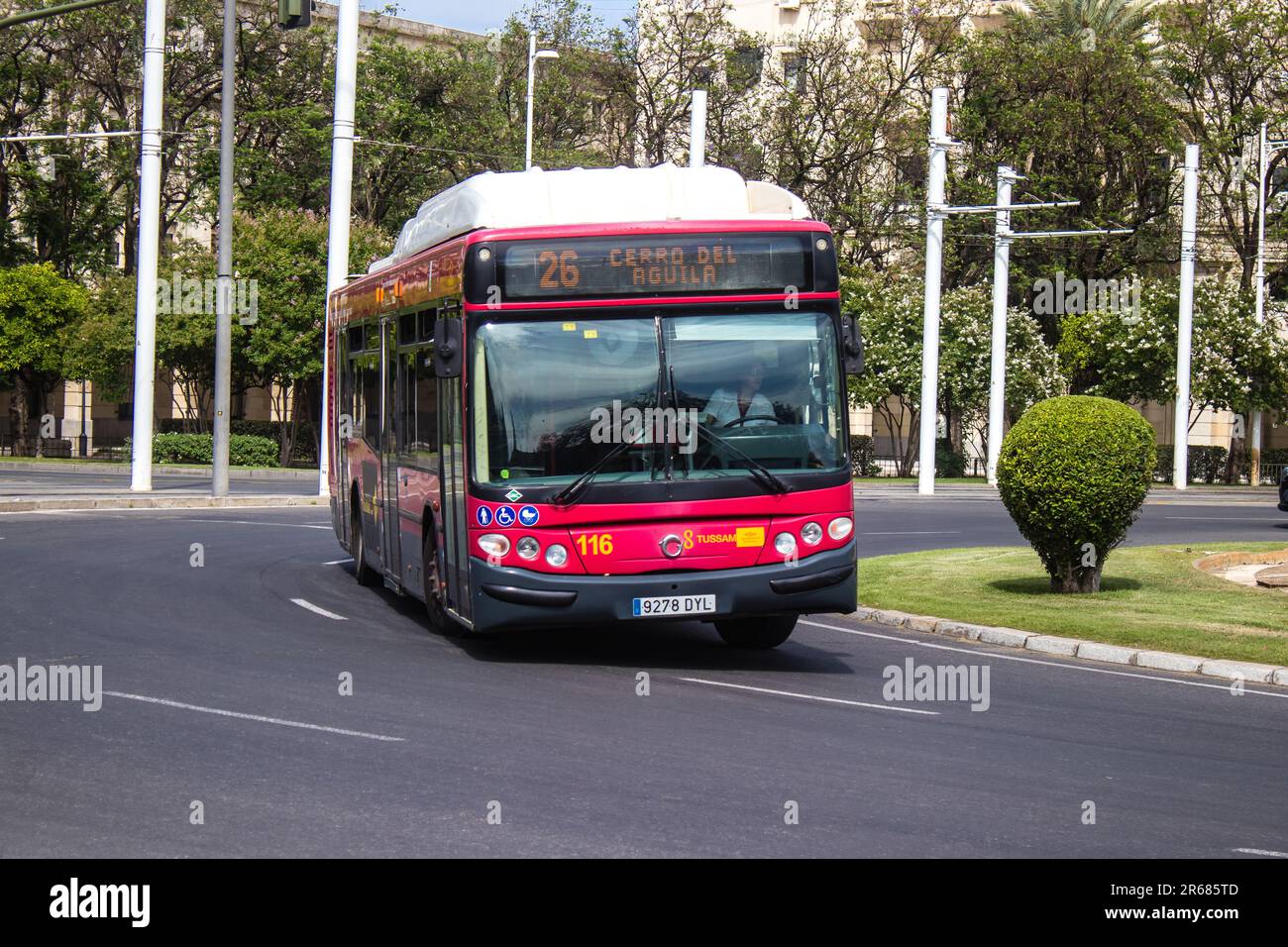 Sevilla, Spain - June 06, 2023 Bus driving in the streets of Sevilla ...