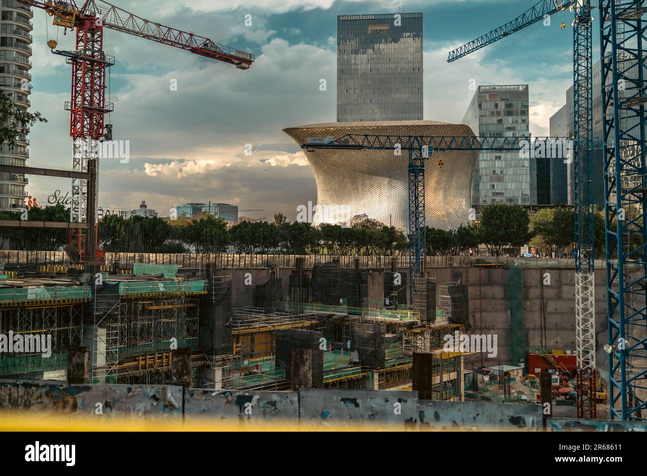 This aerial shot showcases a bustling construction site below featuring ...