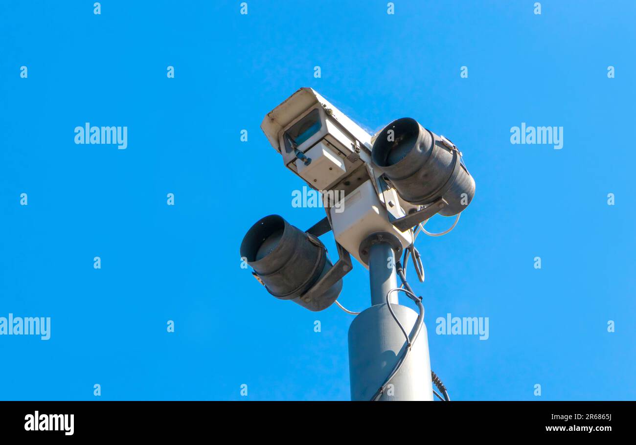 looking up at isolated CCTV security camera with infrared lights, big ...
