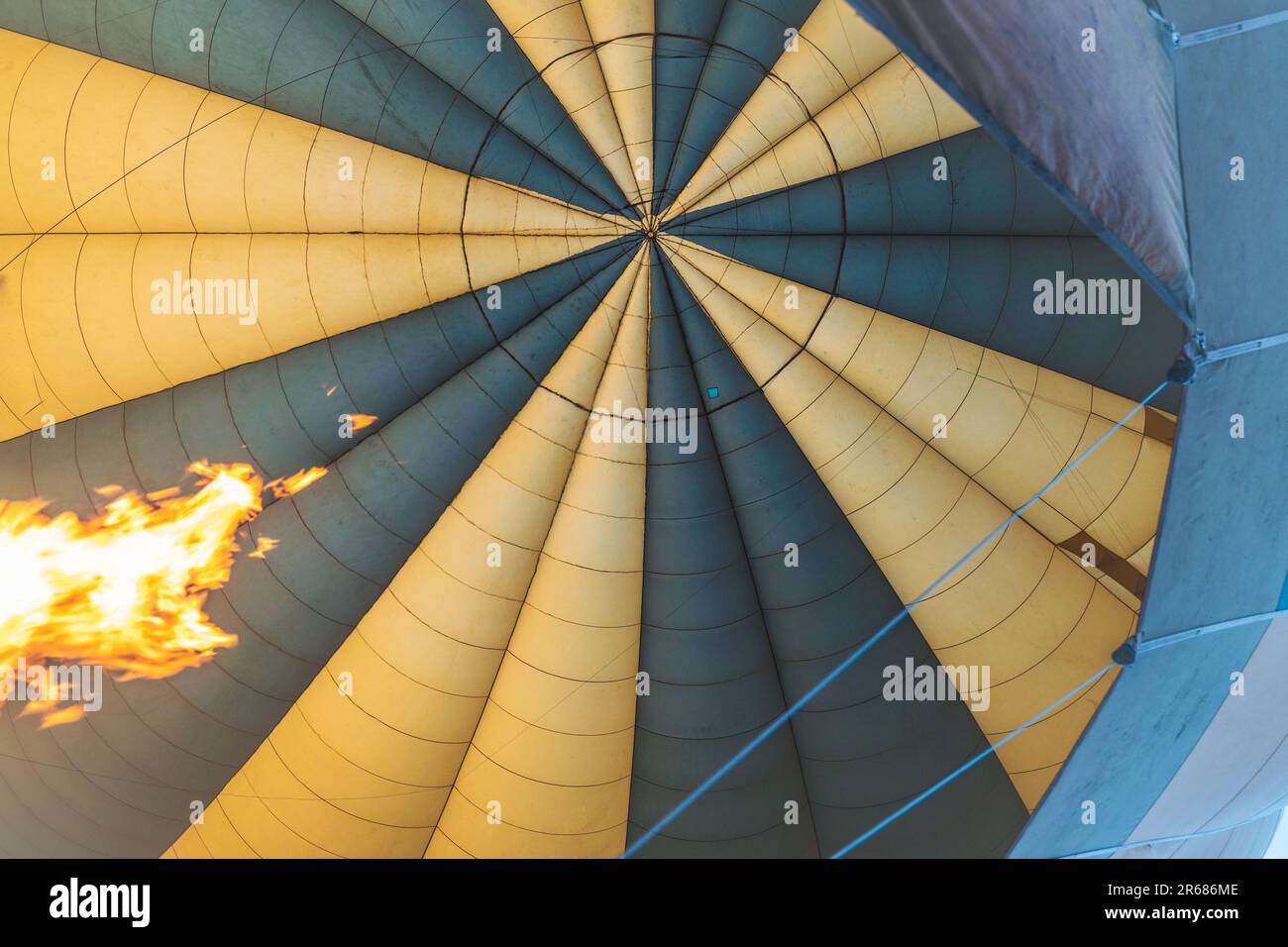 Looking up at a hot air balloon as the fire inflates the balloon to ...