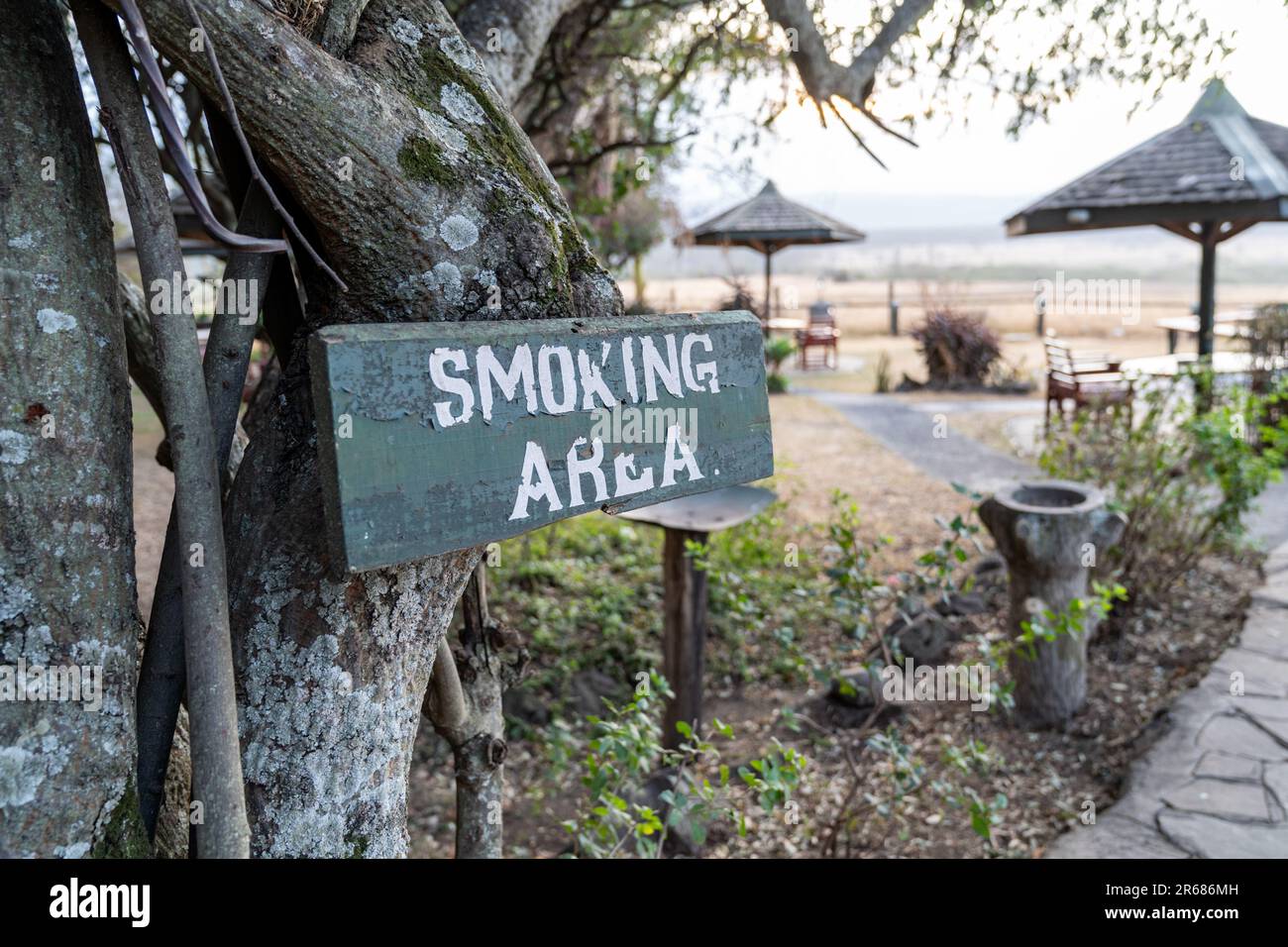 Rustic sign with peeling letters indicating a smoking area Stock Photo ...