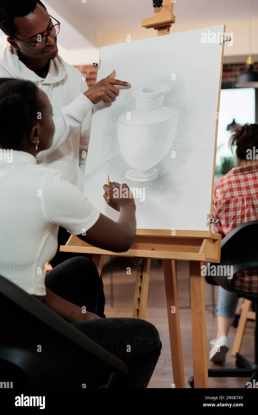Young happy African American couple spending time together at art class ...