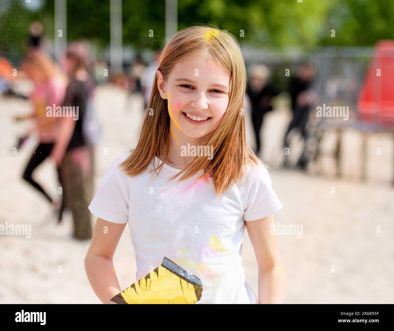 Preteen girl in indian traditional Holi festival with colorful powder ...