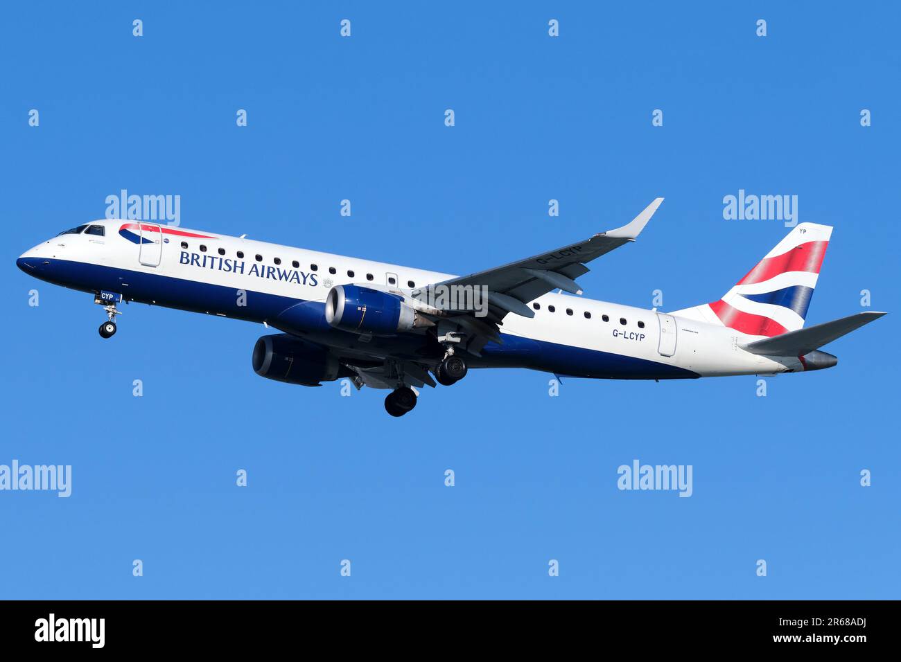 A British Airways aircraft is depicted soaring through a bright blue ...