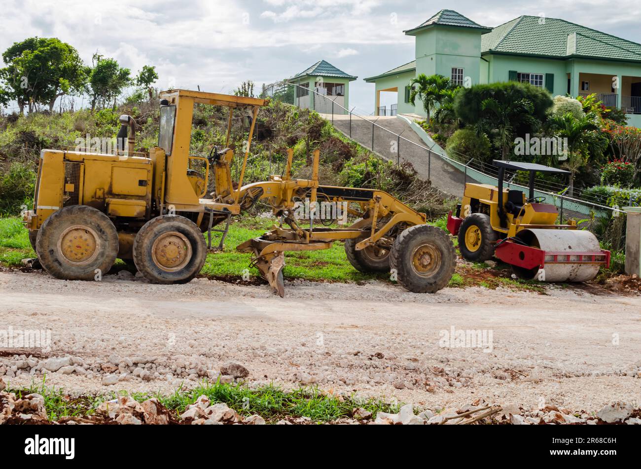 Roller Compactor and Road Grader Stock Photo - Alamy